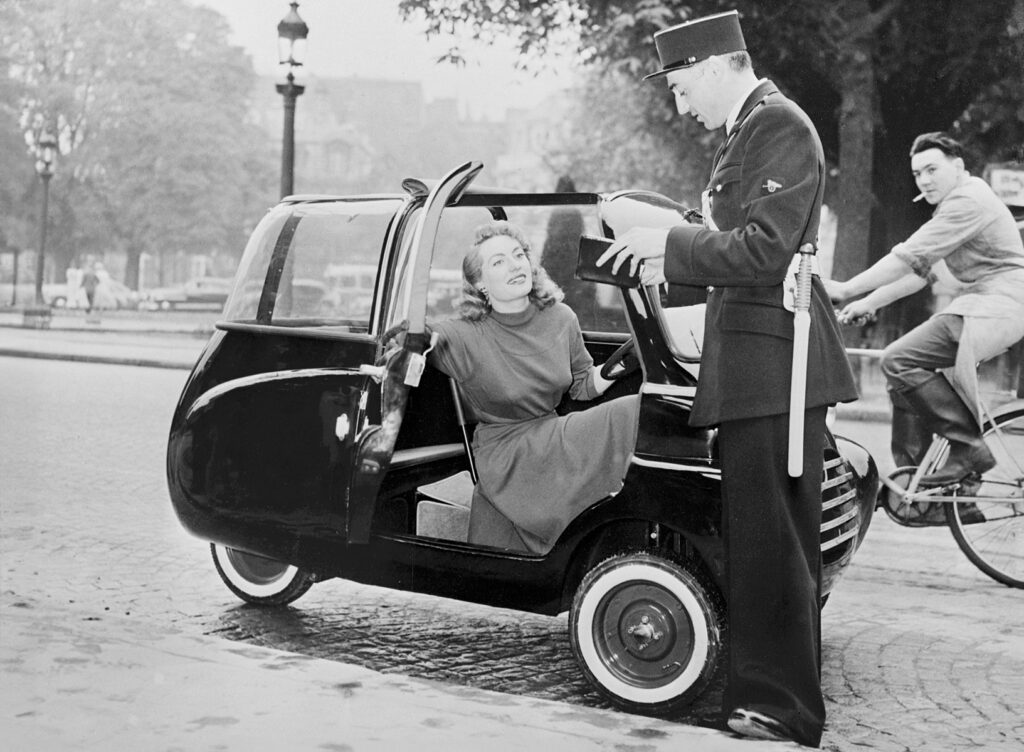 Lady in bubble car blank card - Holy Mackerel